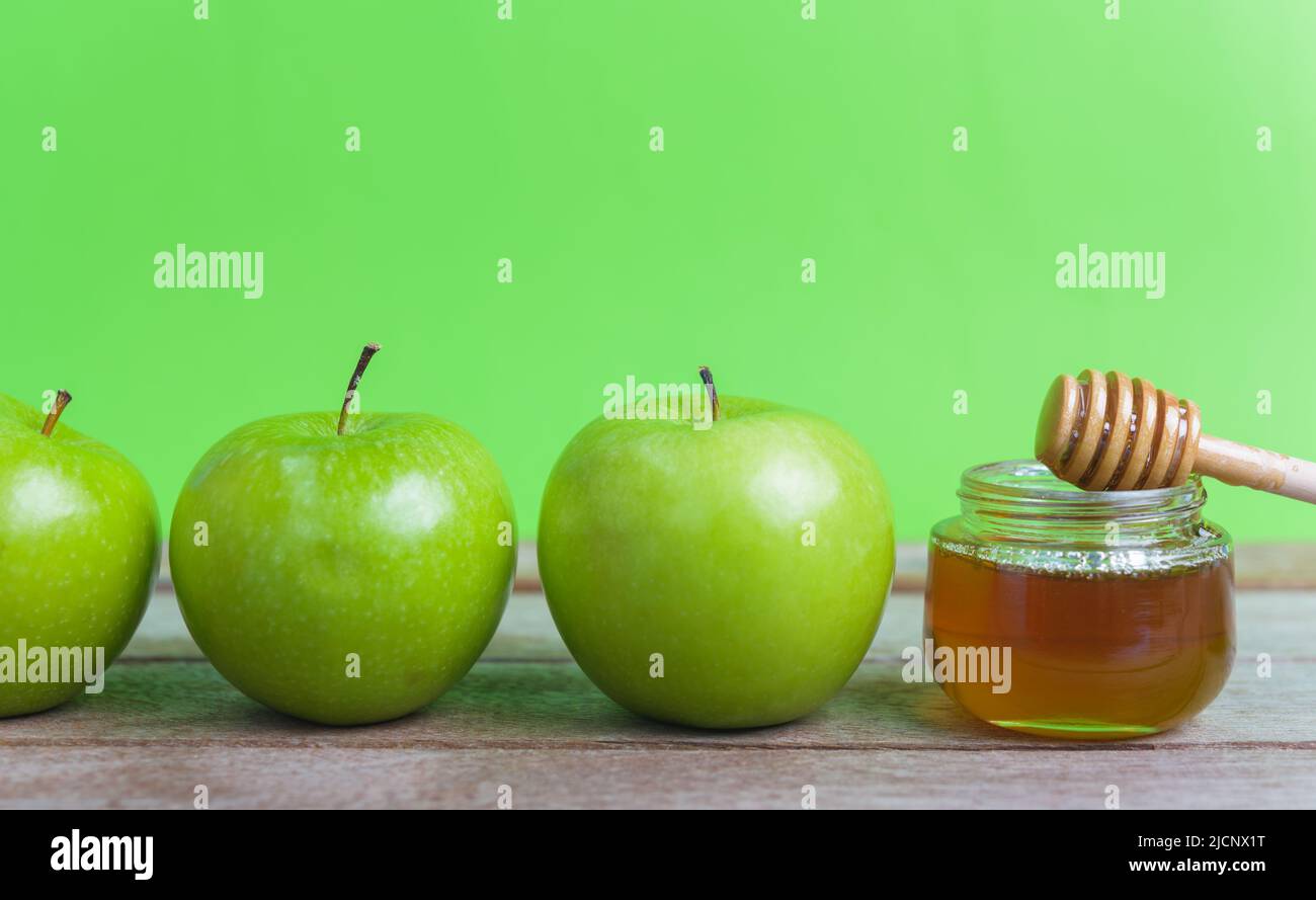 Jewish holiday, Apple Rosh Hashanah, on the photo have honey in jar and ...