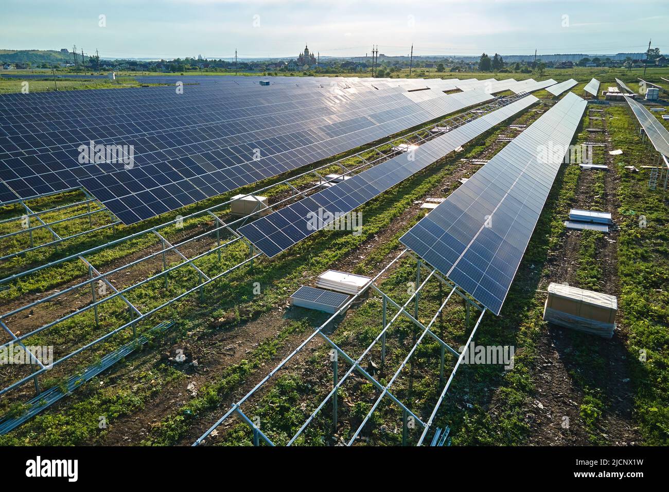 Aerial view of big electric power plant under construction with many ...