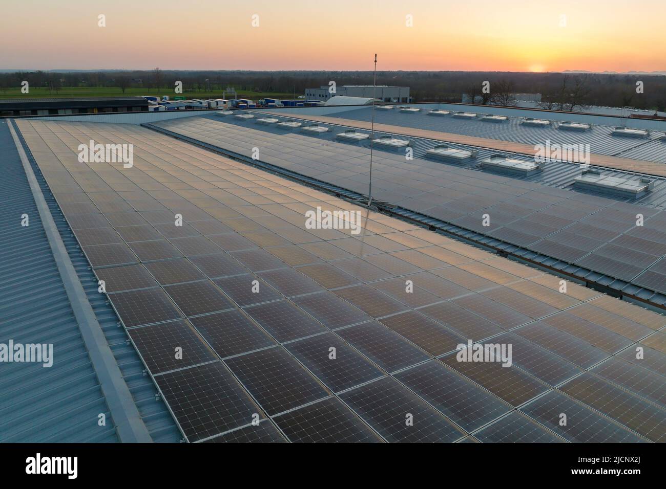 Aerial view of blue photovoltaic solar panels mounted on industrial ...