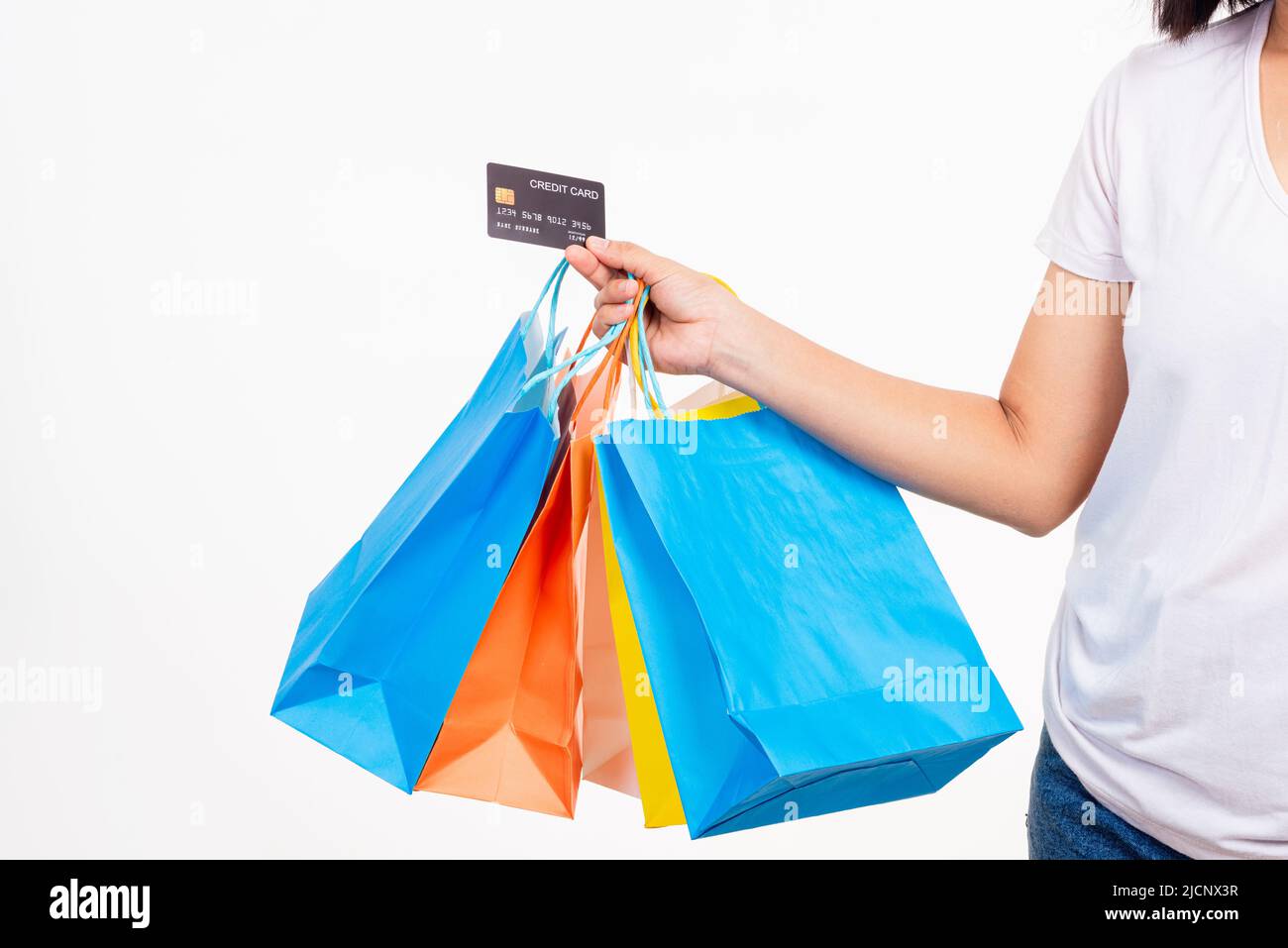 Happy woman hand holding shopping bags multicolor and credit card for ...