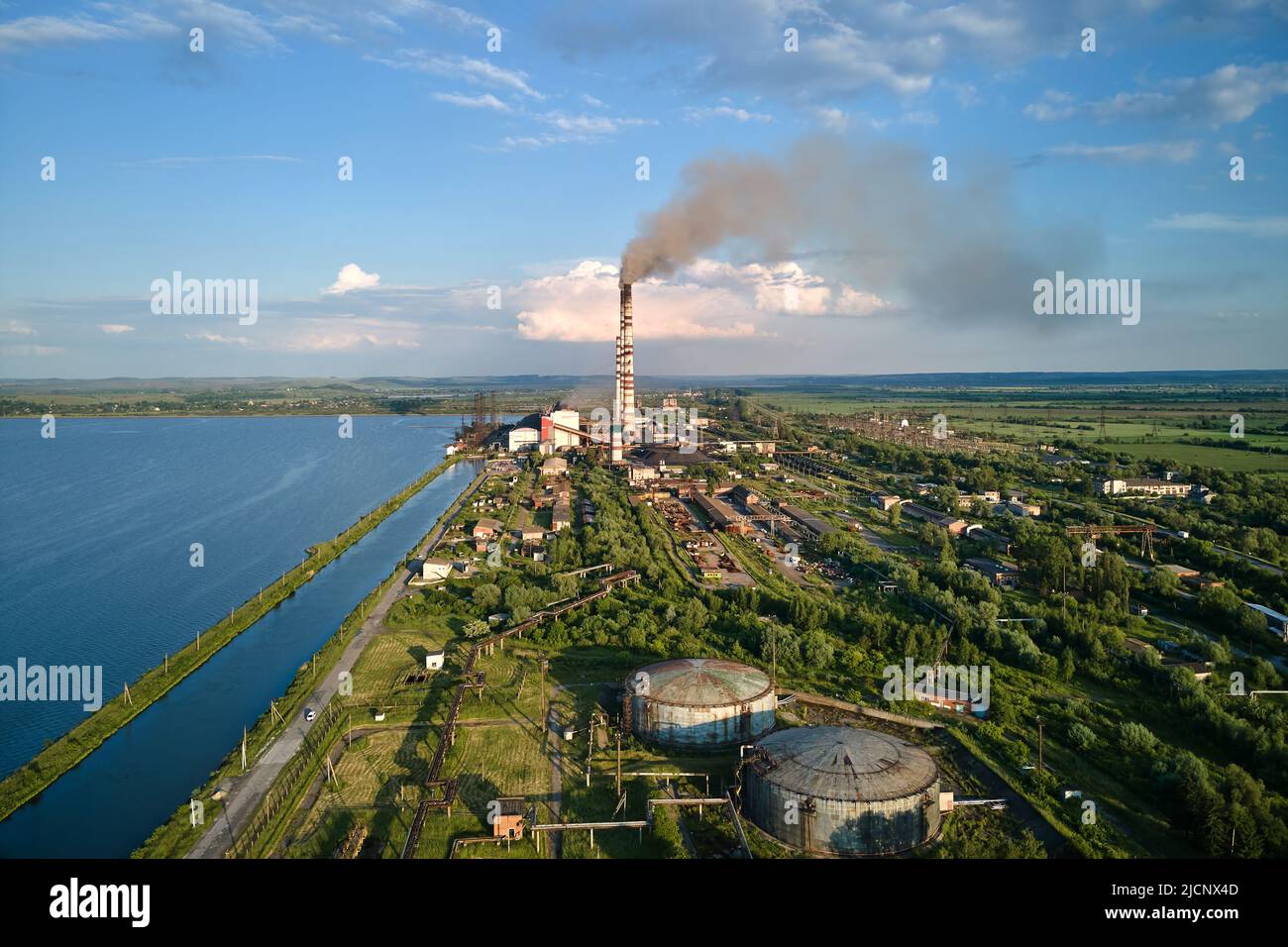 Aerial view of coal power plant high pipes with black smokestack ...