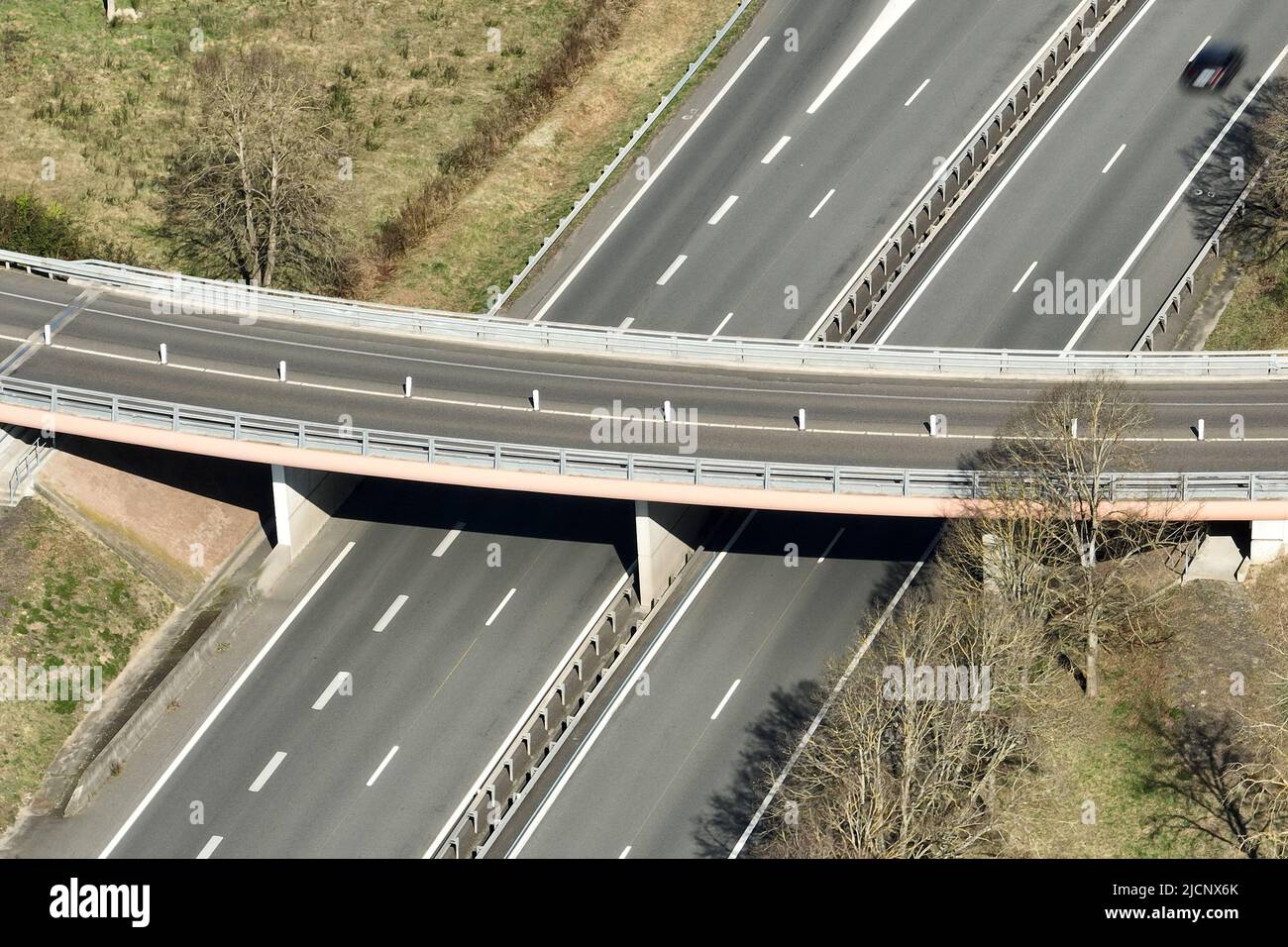 Aerial view of highway road intersection with fast moving heavy traffic ...