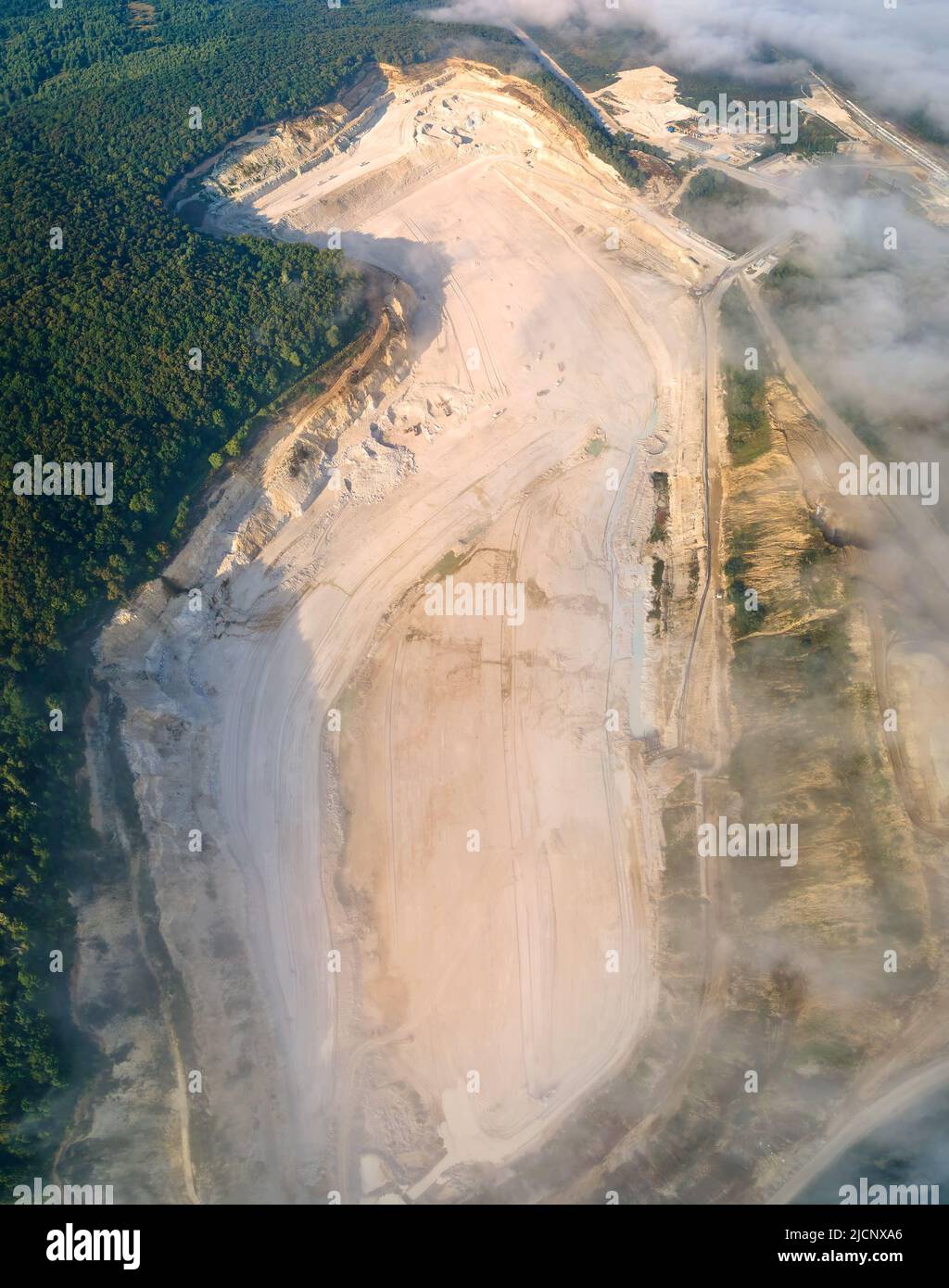 Aerial view of open pit mining site of limestone materials extraction ...