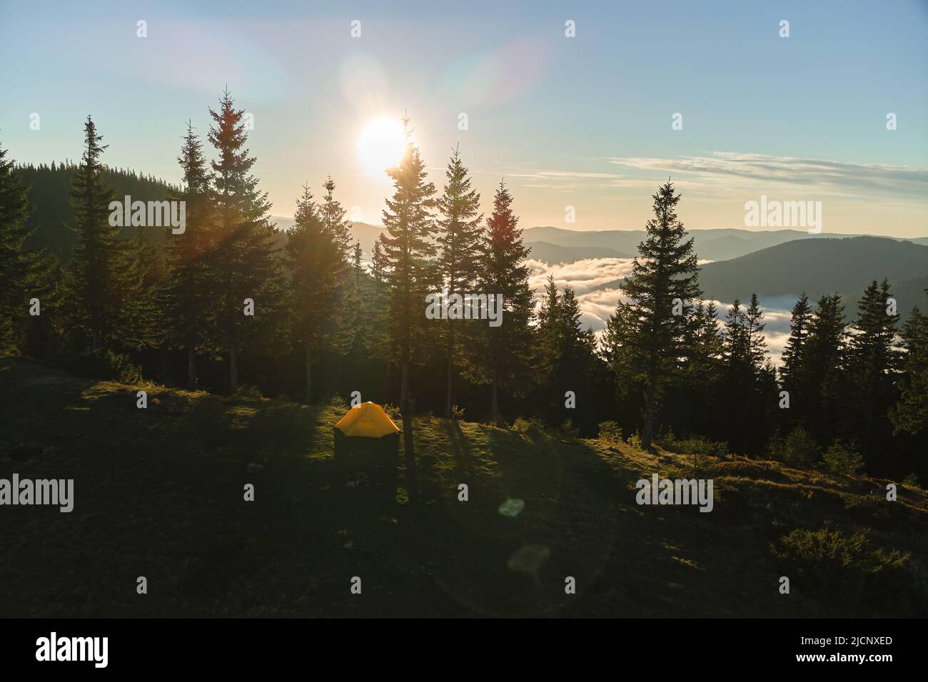 Aerial view of tourist camping tent on mountain campsite at bright ...