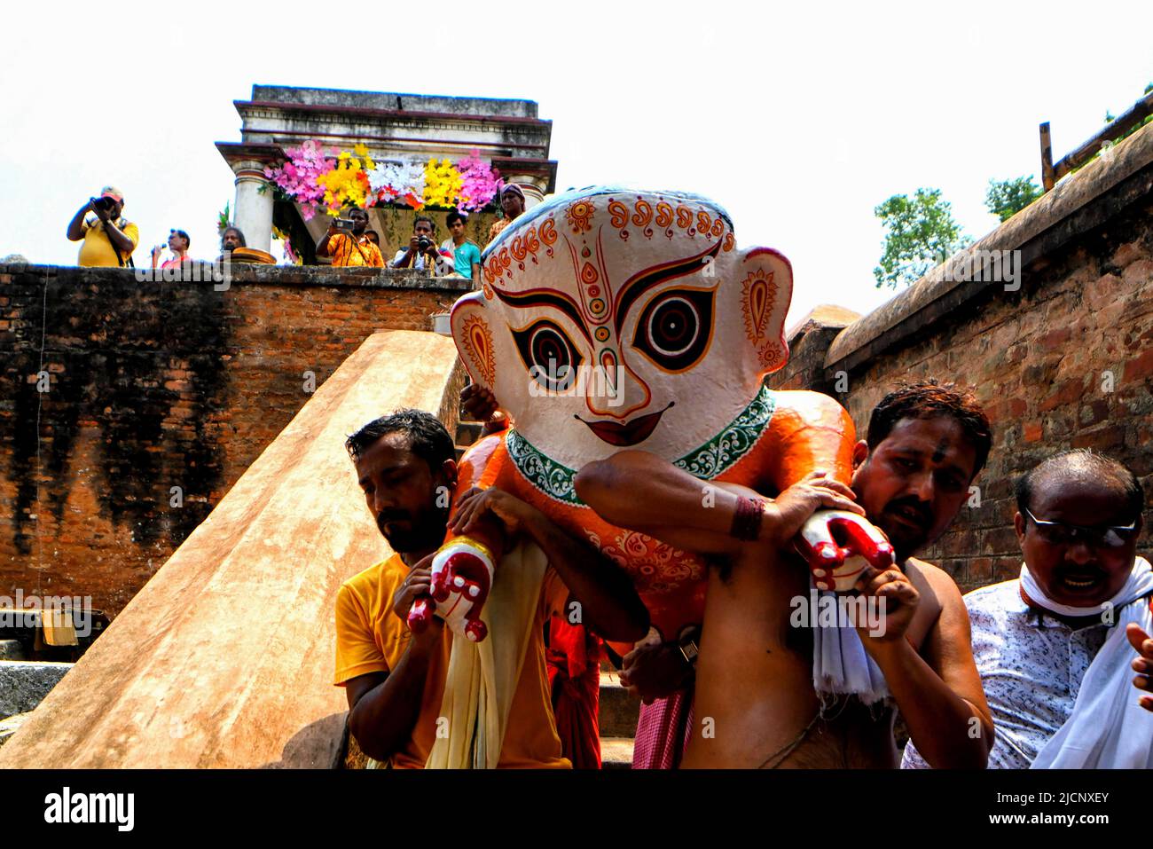 Guptipara, India. 14th June, 2022. Hindu devotees seen carrying an Idol ...