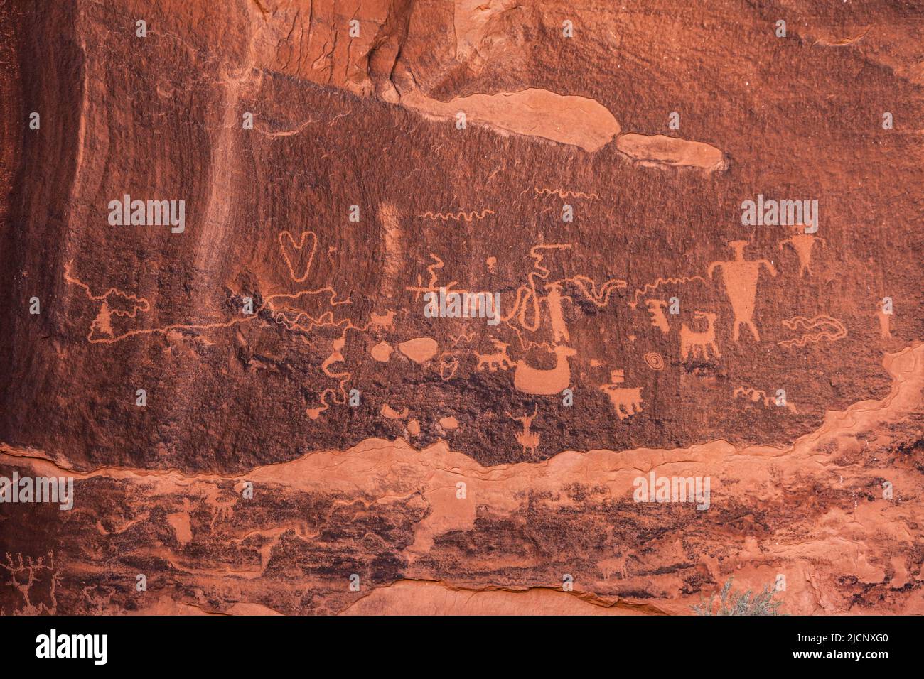Ancestral Puebloan Native American rock art on the dark desert ...
