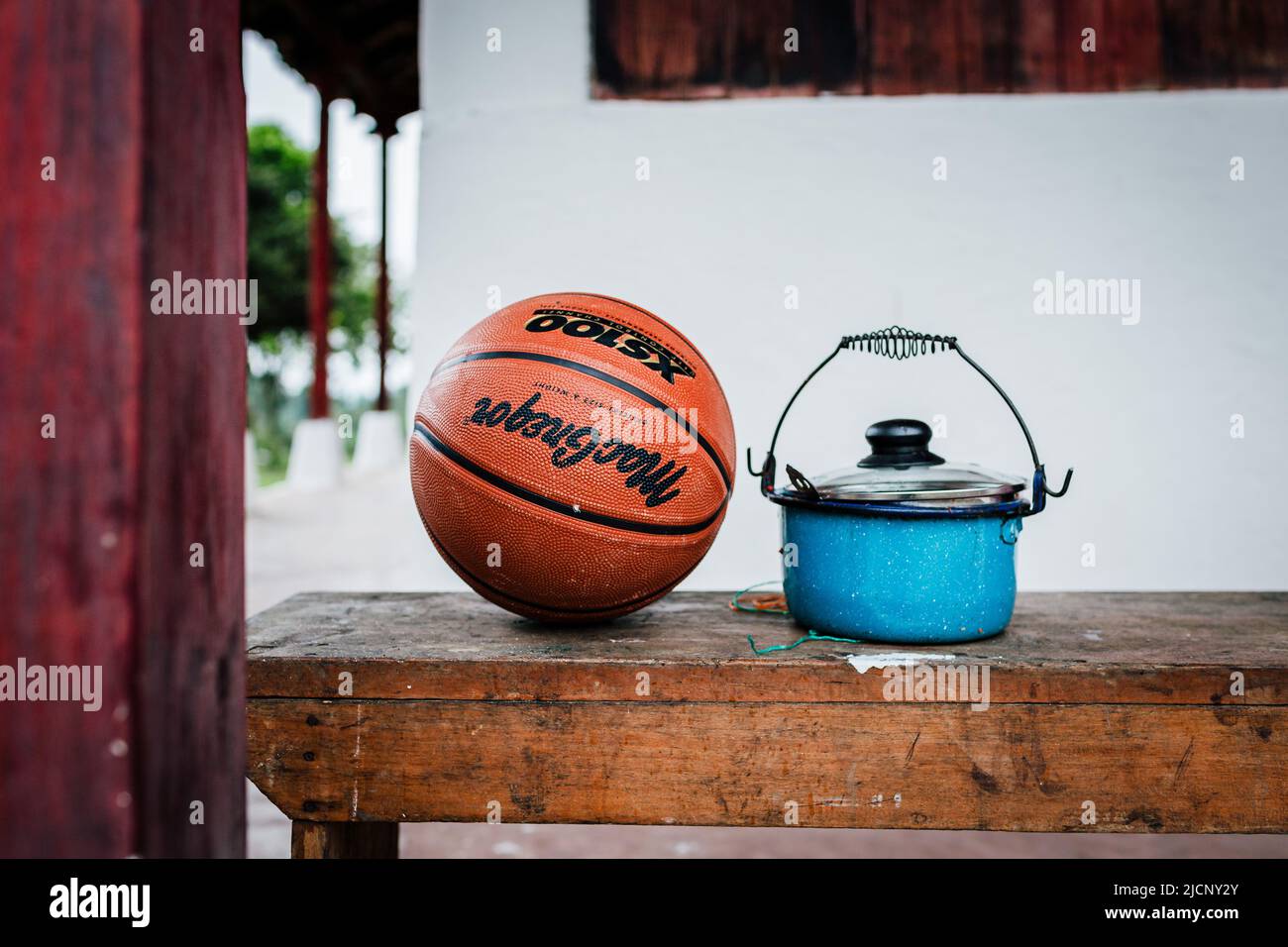 Still life: basketball and cooking pot on a wooden bench - Nebaj ...
