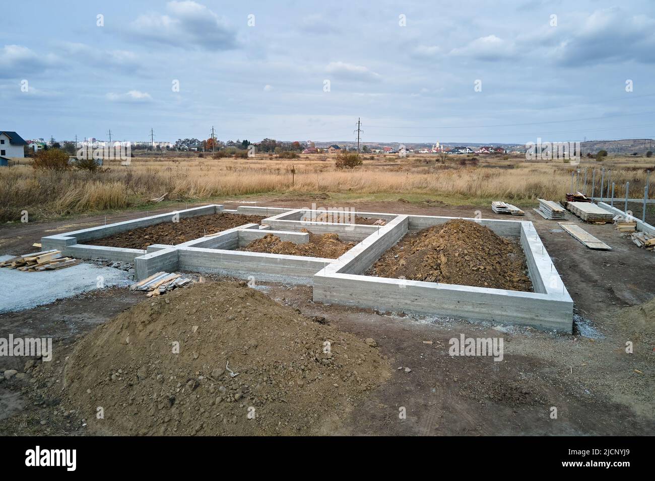 Top down aerial view of building works of new house concrete foundation ...