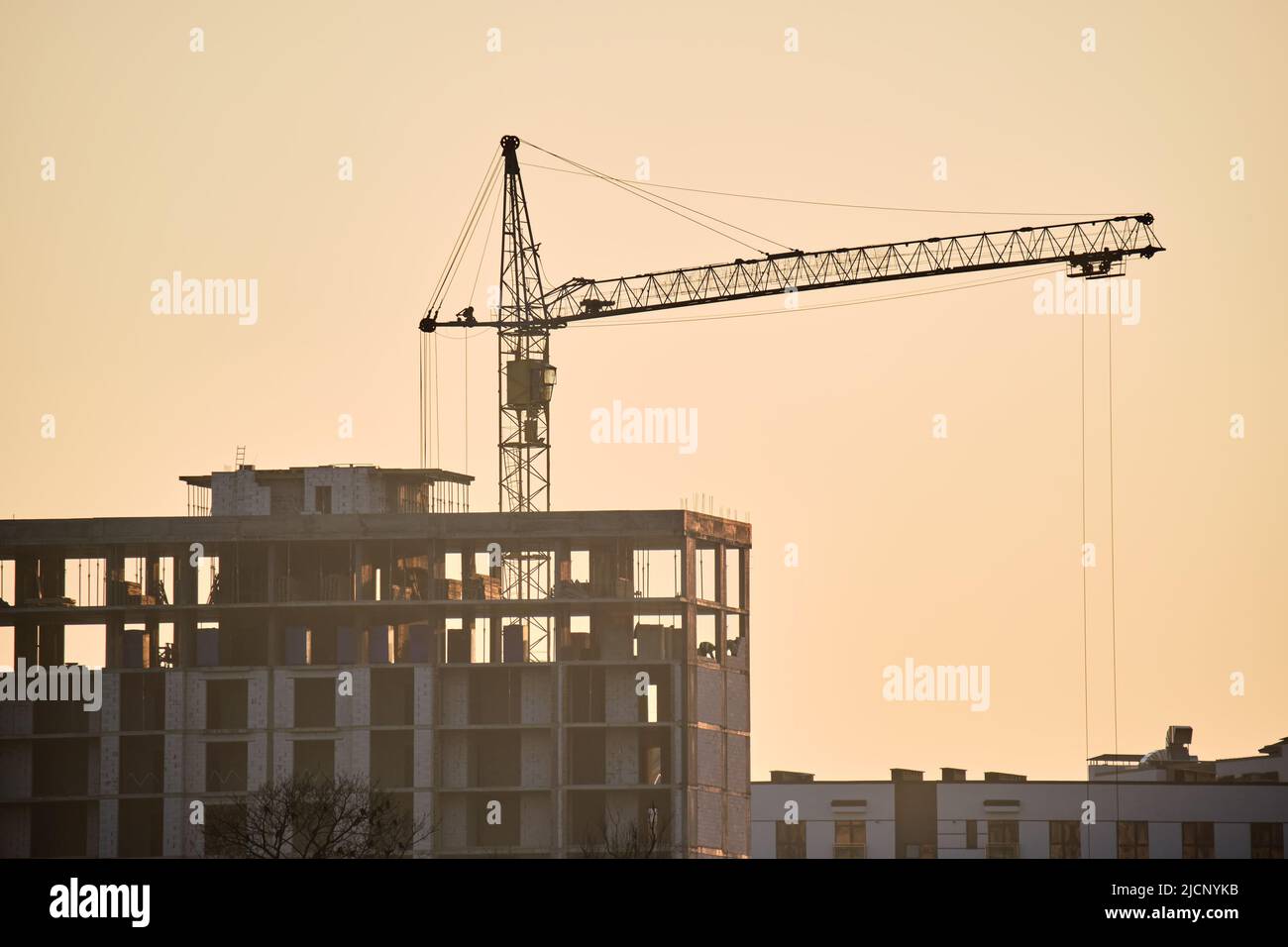 Tower crane at high residential apartment buildings construction site ...