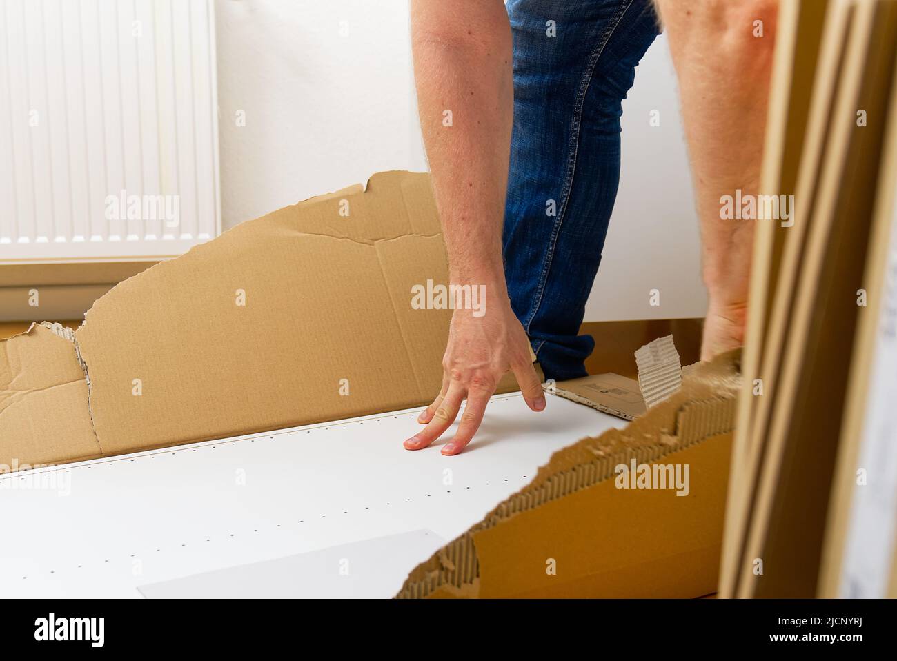 Professional Furniture Assembly Worker Assembles Shelf. Furniture ...
