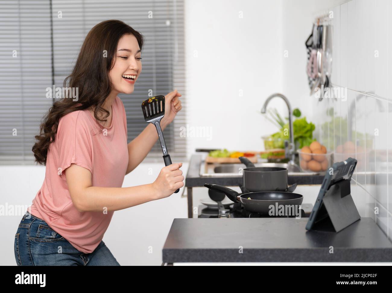 cheerful young vlogger woman singing with turner and live streaming ...