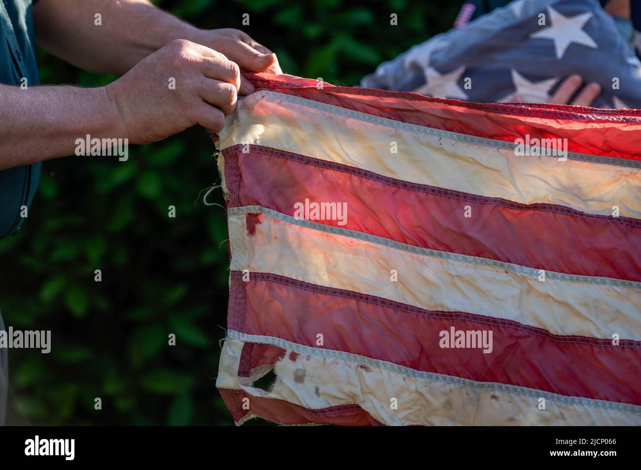 A flag is folded before being retired. Flag Day in America is June 14th ...