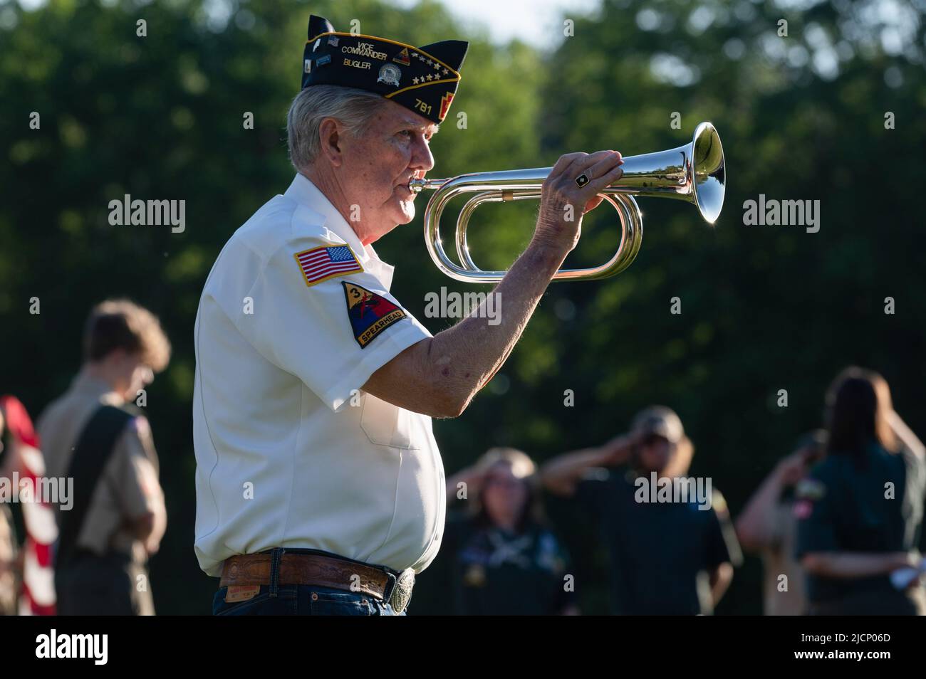 A member of the American Legion plays taps during a flag retirement ...