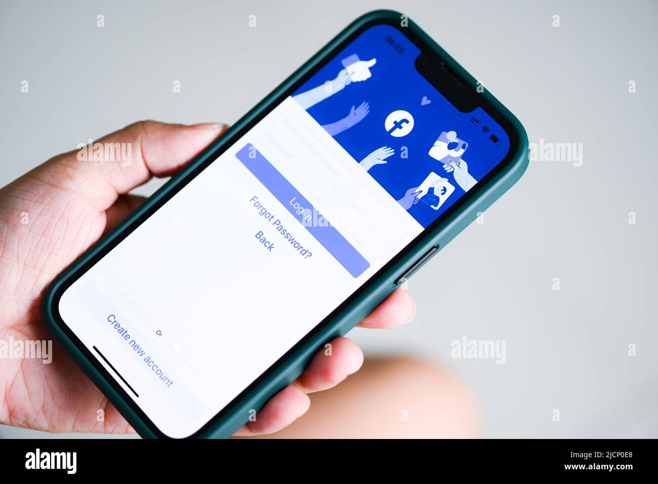 Facebook application icon on Apple iPhone 13 Pro, holding smartphone ...