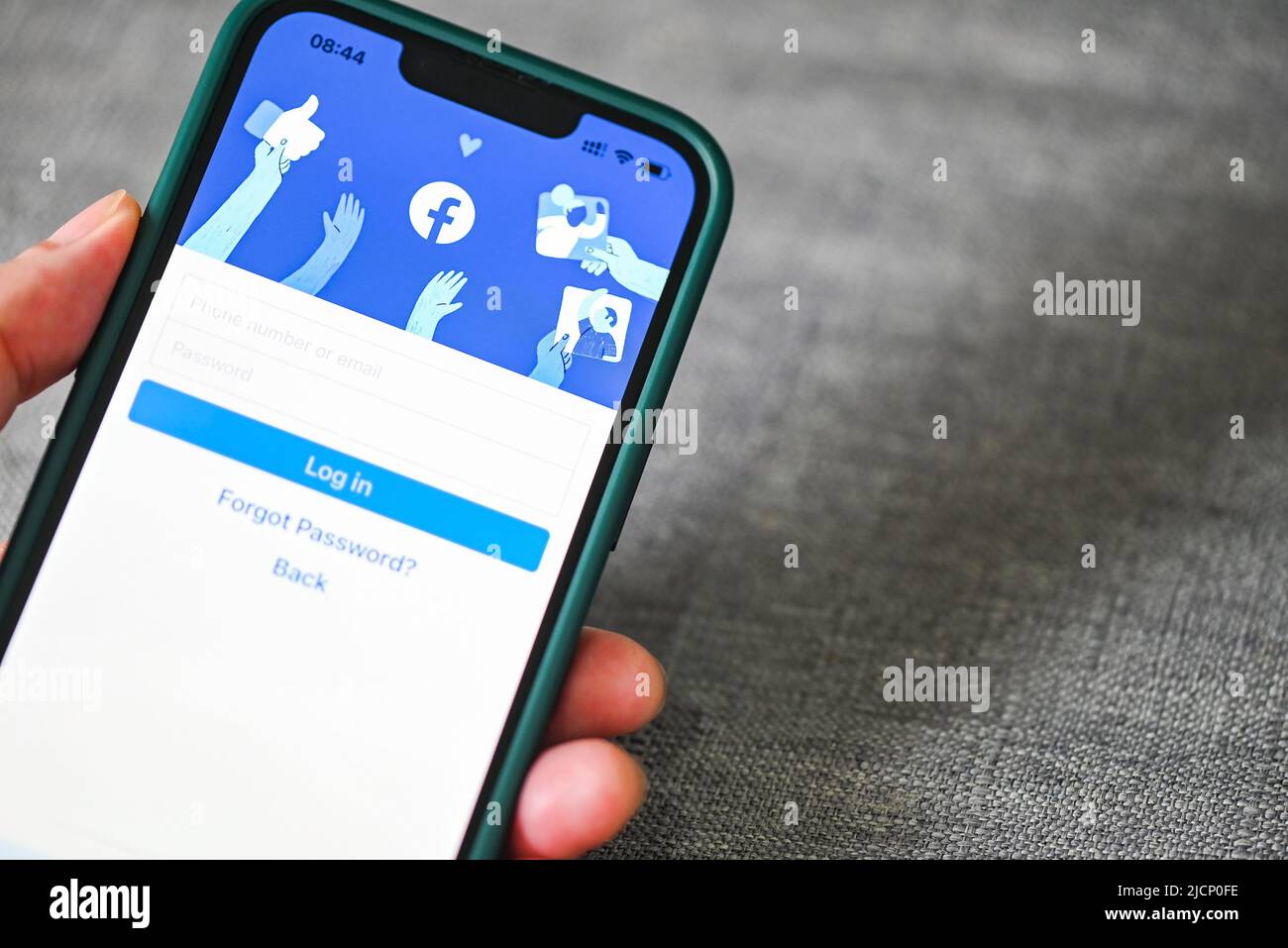 Facebook application icon on Apple iPhone 13 Pro, holding smartphone ...