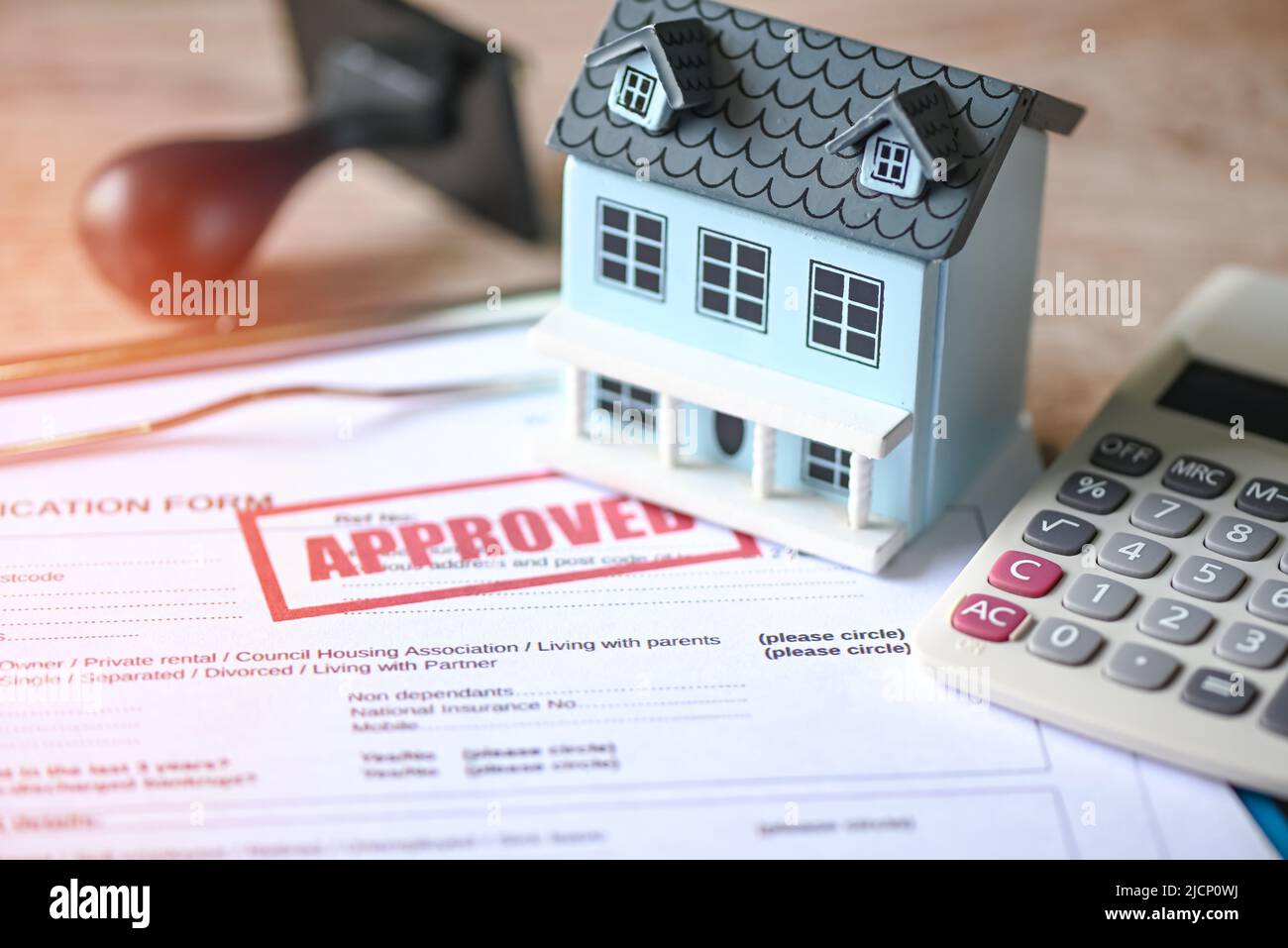Home loan approved on loan application form paper with rubber stamp ...