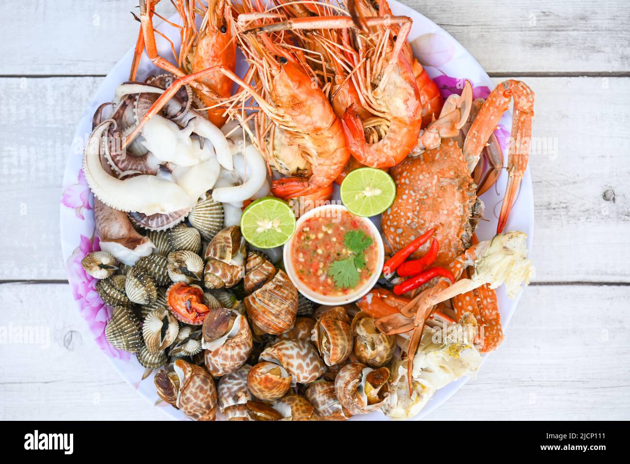 seafood plate with shrimp shellfish crab squid cockle spotted babylon ...