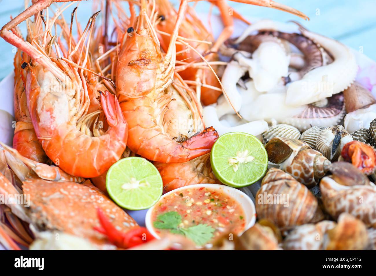 seafood plate with shrimp shellfish crab squid cockle spotted babylon ...