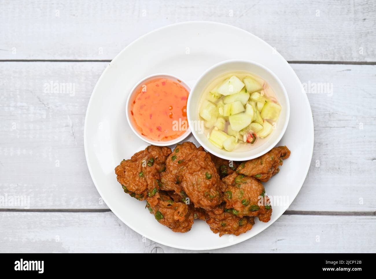 fish cakes on white plate , fried fish paste balls with sauce - Asian ...