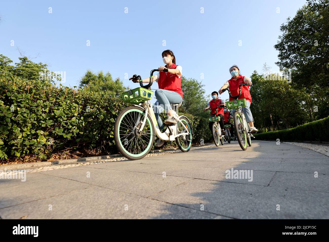 ZAOZHUANG, CHINA - JUNE 15, 2022 - Volunteers ride shared bikes in ...