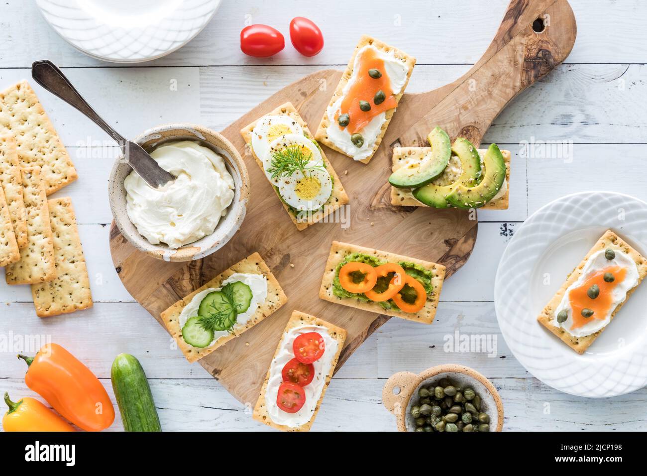 Top down view of everything crackers with various fresh savoury ...