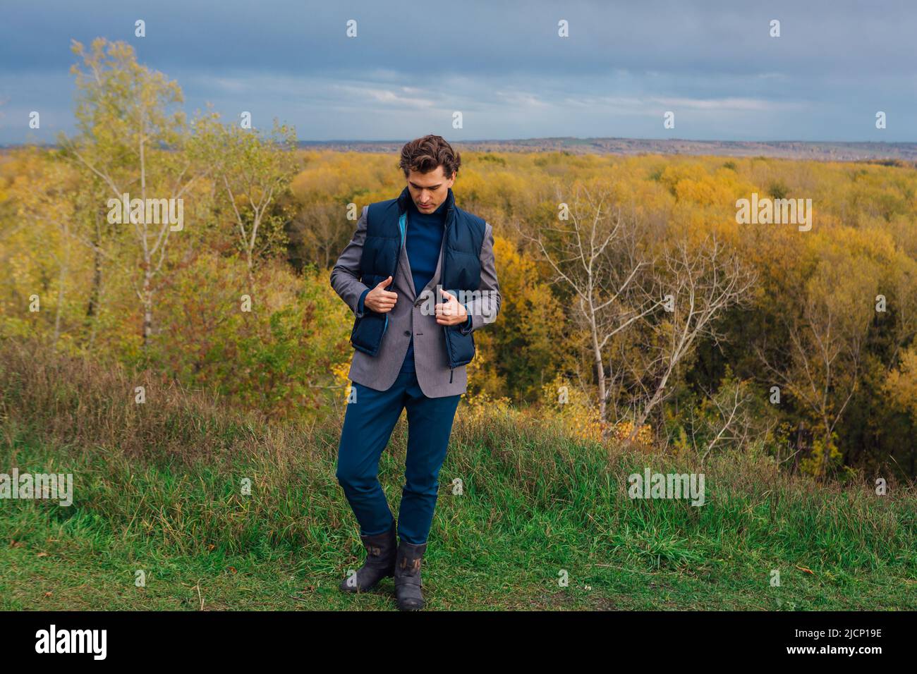 Tall handsome man outdoor in autumn forest on the hill Stock Photo - Alamy
