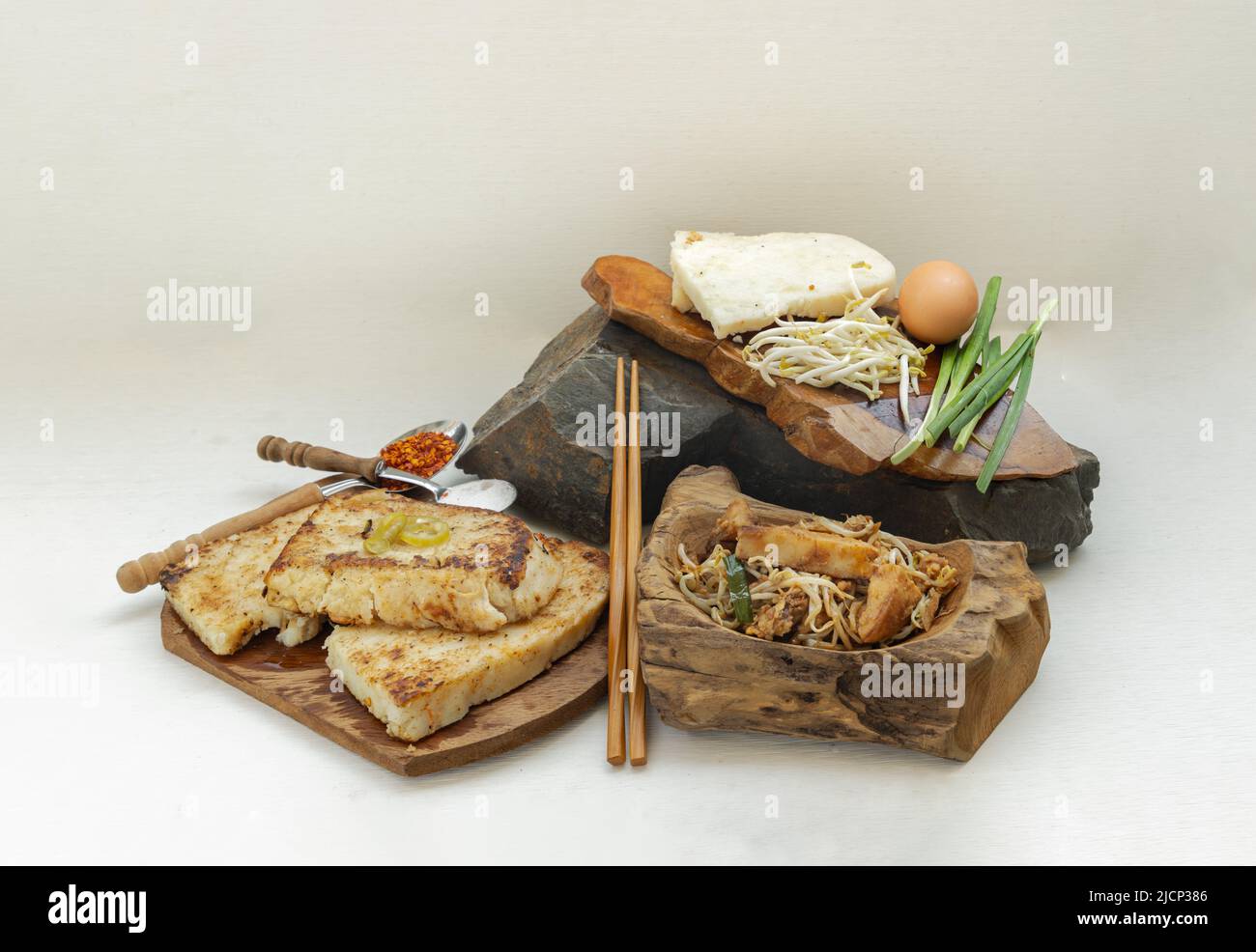 Stir-fried soft turnip cake or Fried radish cake (chai tow kway) with ...