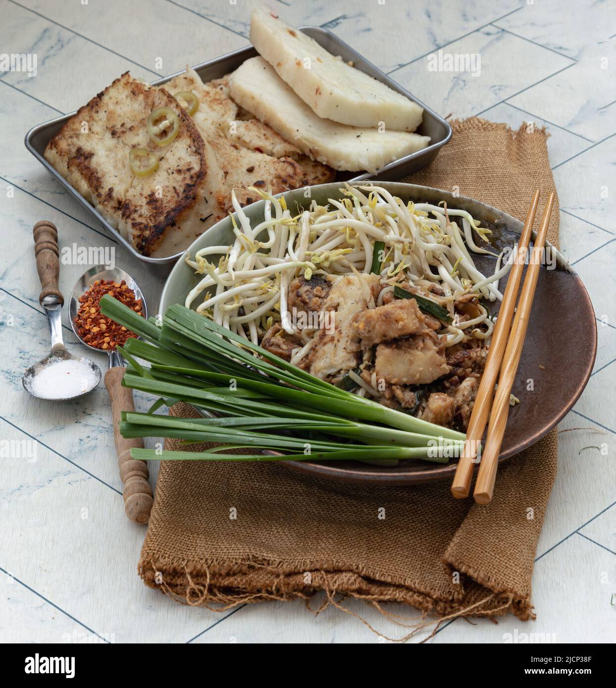 Stir fried soft turnip cake or Fried radish cake (chai tow kway) with ...