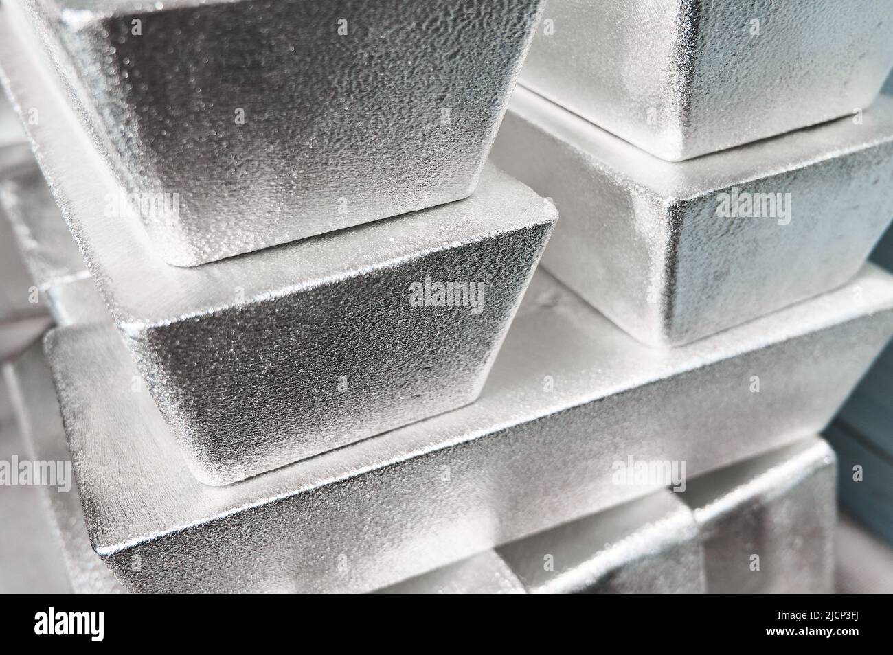 Pile of industrial silver bars at bright light in storage Stock Photo ...