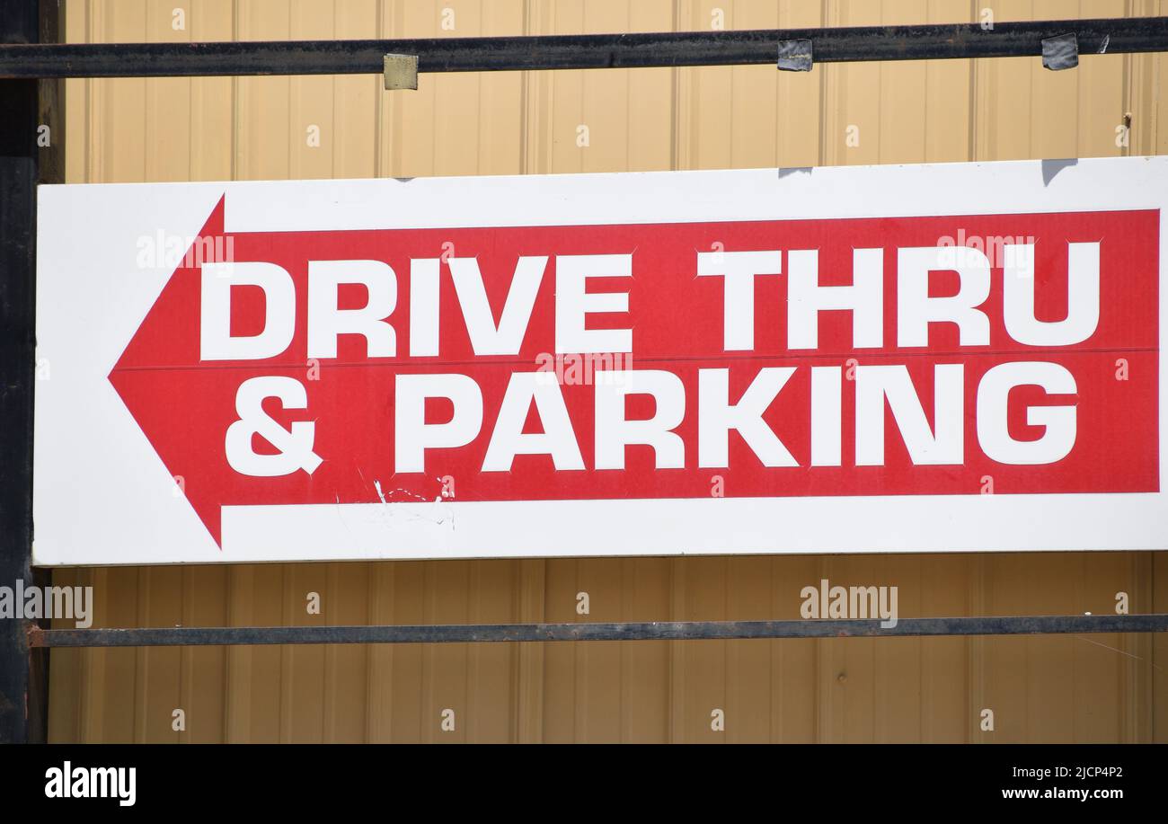 Drive Thru & Parking Sign, red arrow pointing left Stock Photo - Alamy