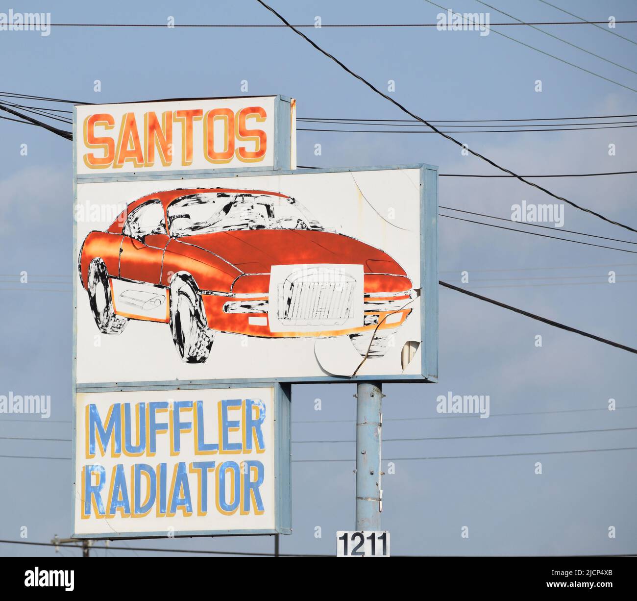 Santos Muffler Radiator shop sign in Irving, Texas Stock Photo - Alamy