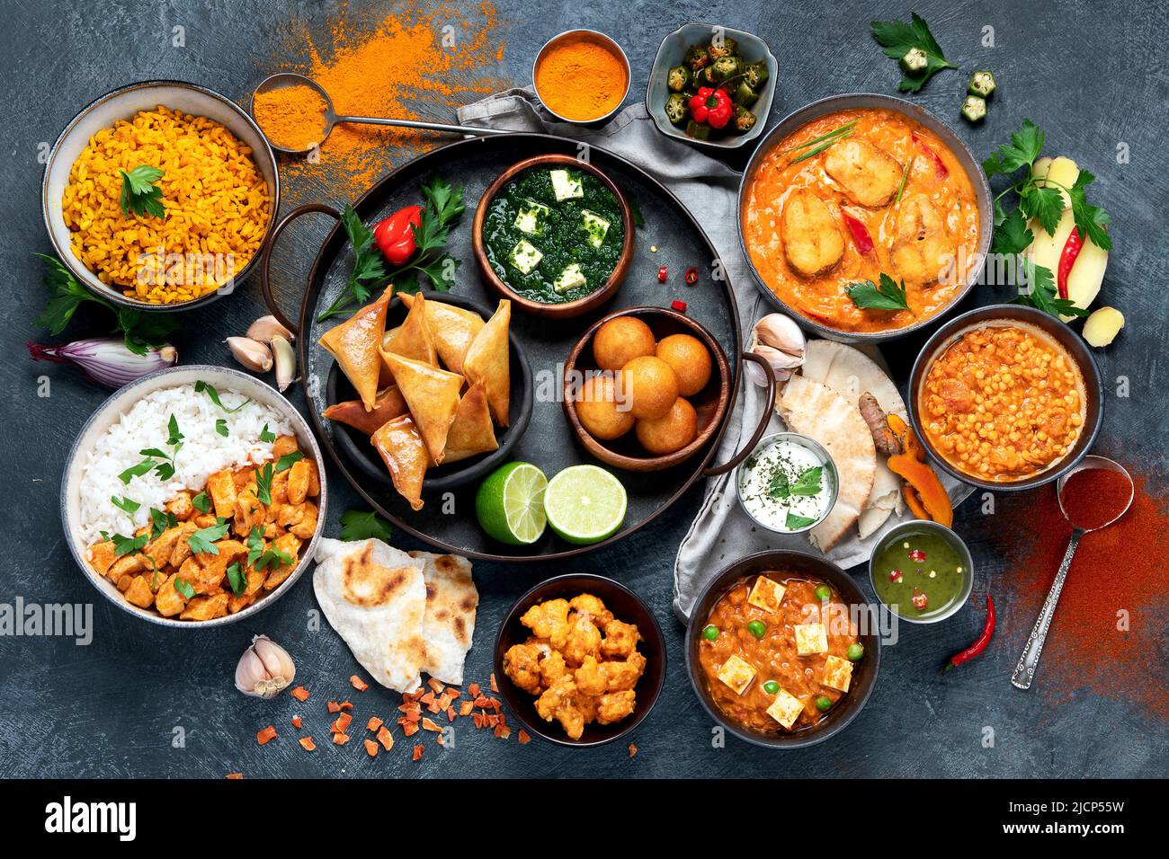 Dishes of indian cuisine. Curry, butter chicken, rice, lentils, paneer ...