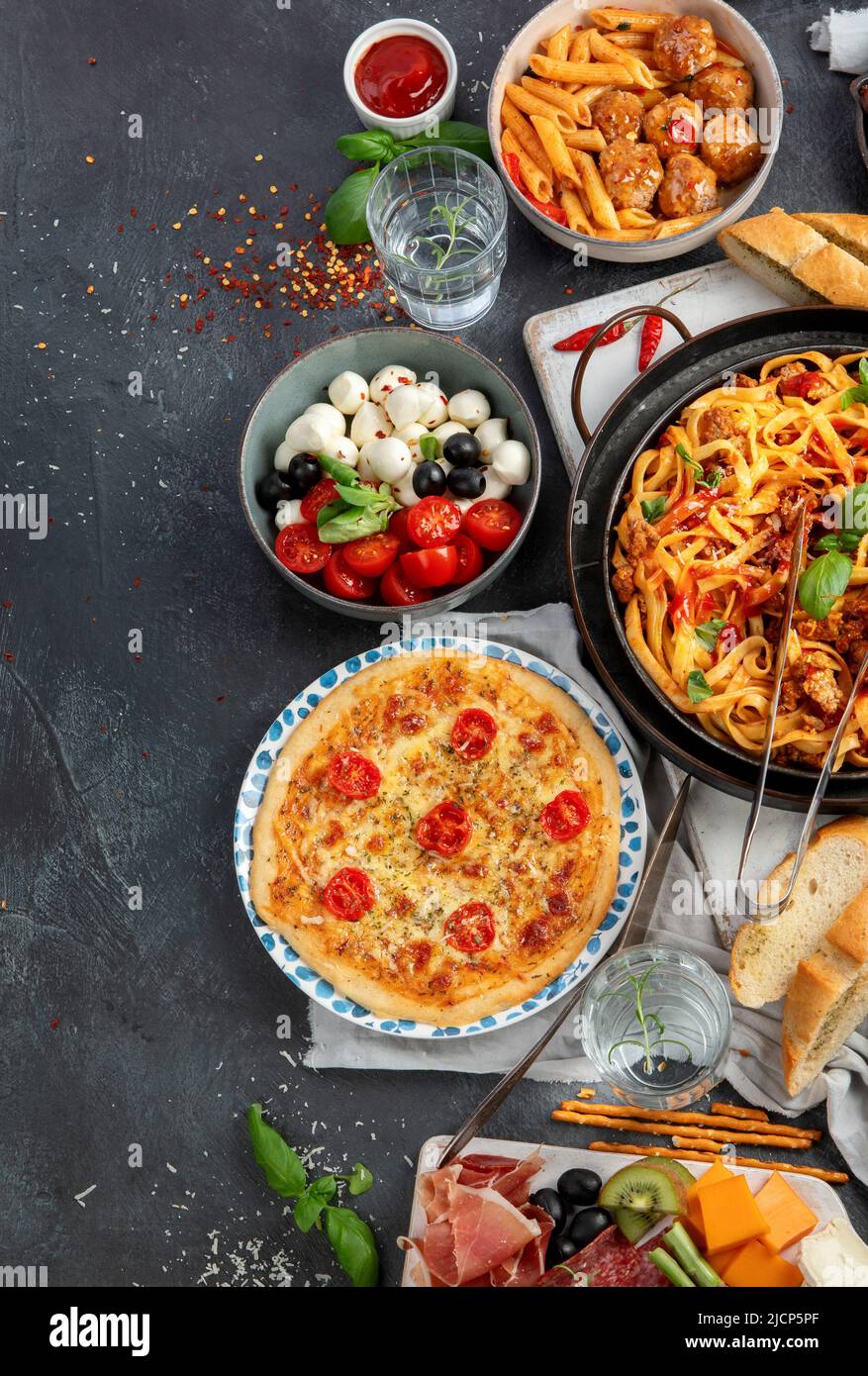Italian food assortment on dark background. Traditional food concept ...