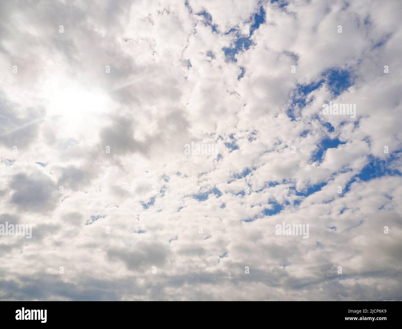 Cloudy summer sky with sun rays using as natural background Stock Photo ...