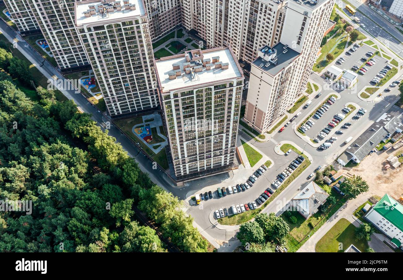 modern residential building complex with outdoor parking lot. aerial view in sunny summer day ...