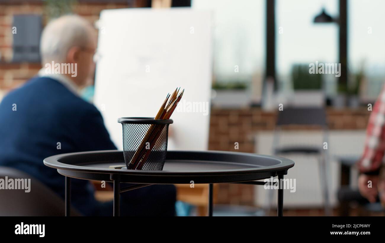 Colorful pencils on table in creative educational workshop used to draw ...