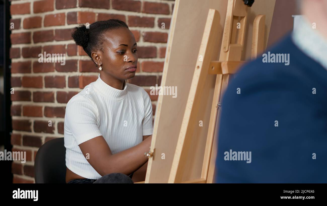 Future artist drawing professional sketch on canvas with easel in art ...