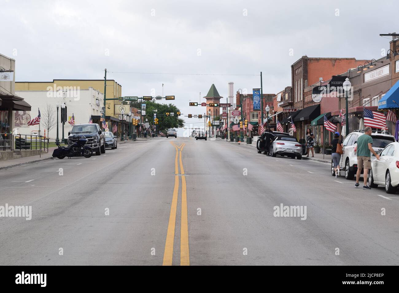 Visitors to historic main street in Grapevine Texas, park their cars ...