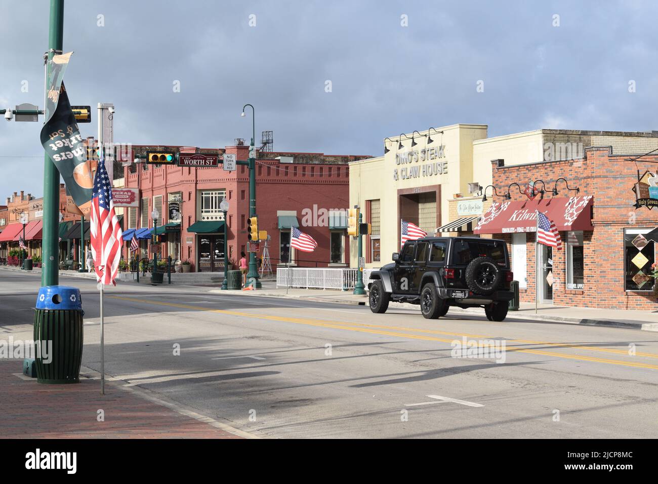 American flags adorn Main Street in historical downtown Grapevine ...