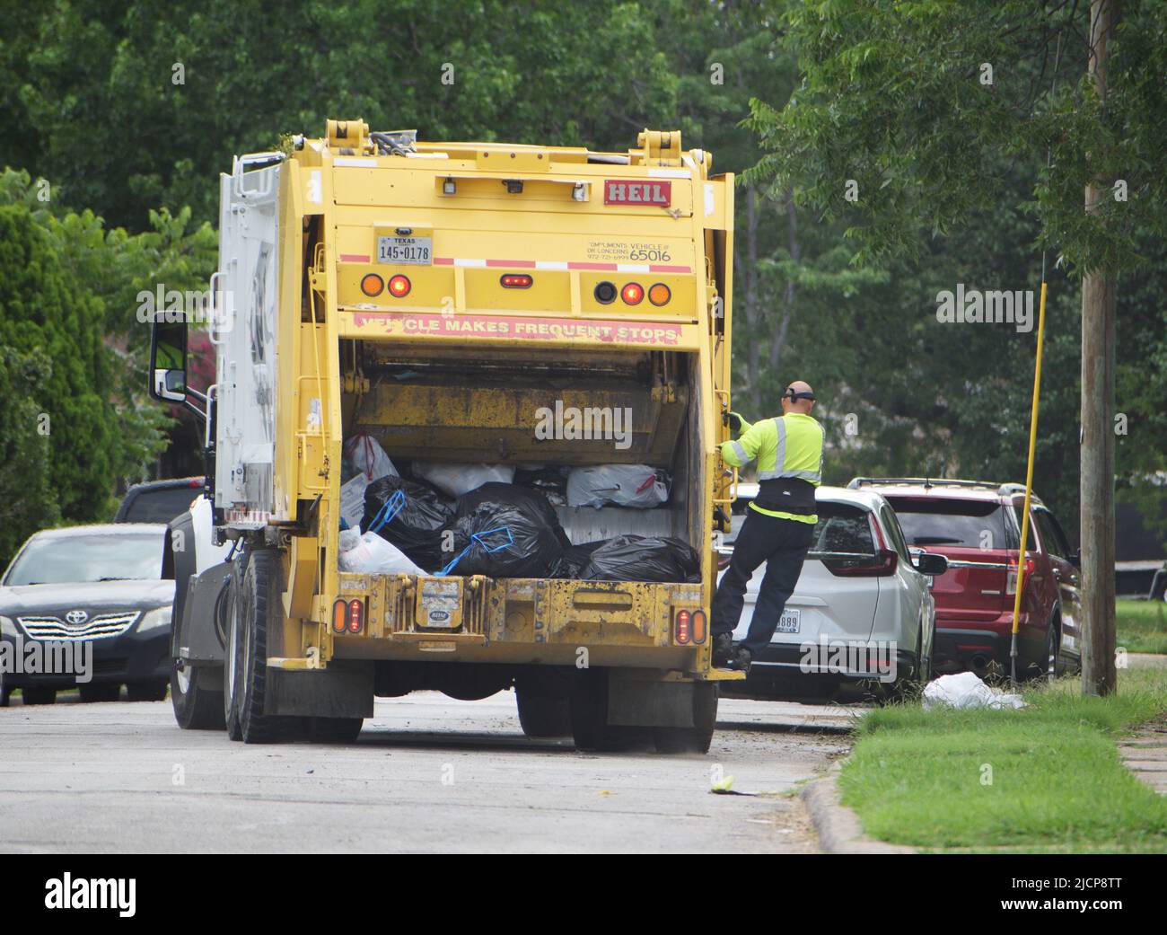 City of Irving Texas sanitation workers picking up trash in a ...