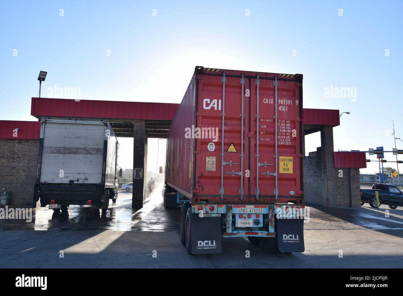 Semi-truck being washed in the early morning at a truck wash in Irving ...