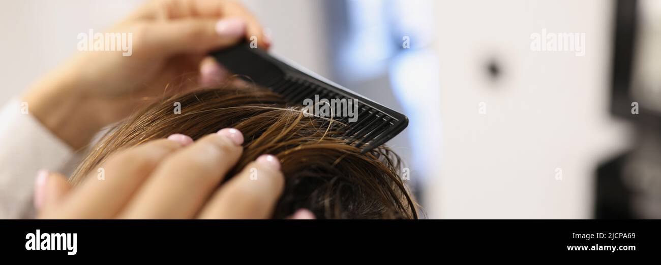 Professional hairdresser use comb for creating stylish haircut Stock ...