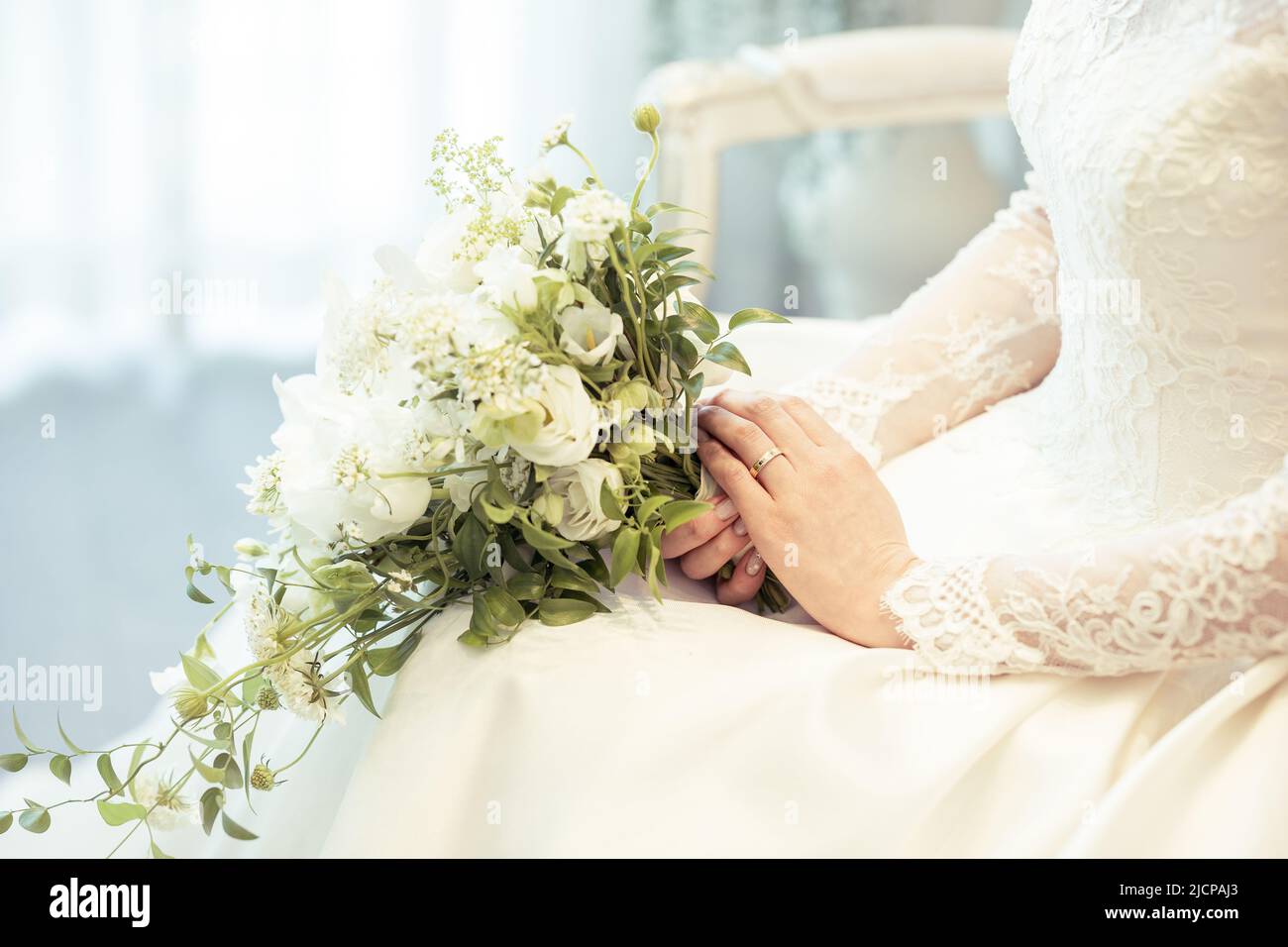 Bride holding a wedding bouquet close up Stock Photo - Alamy