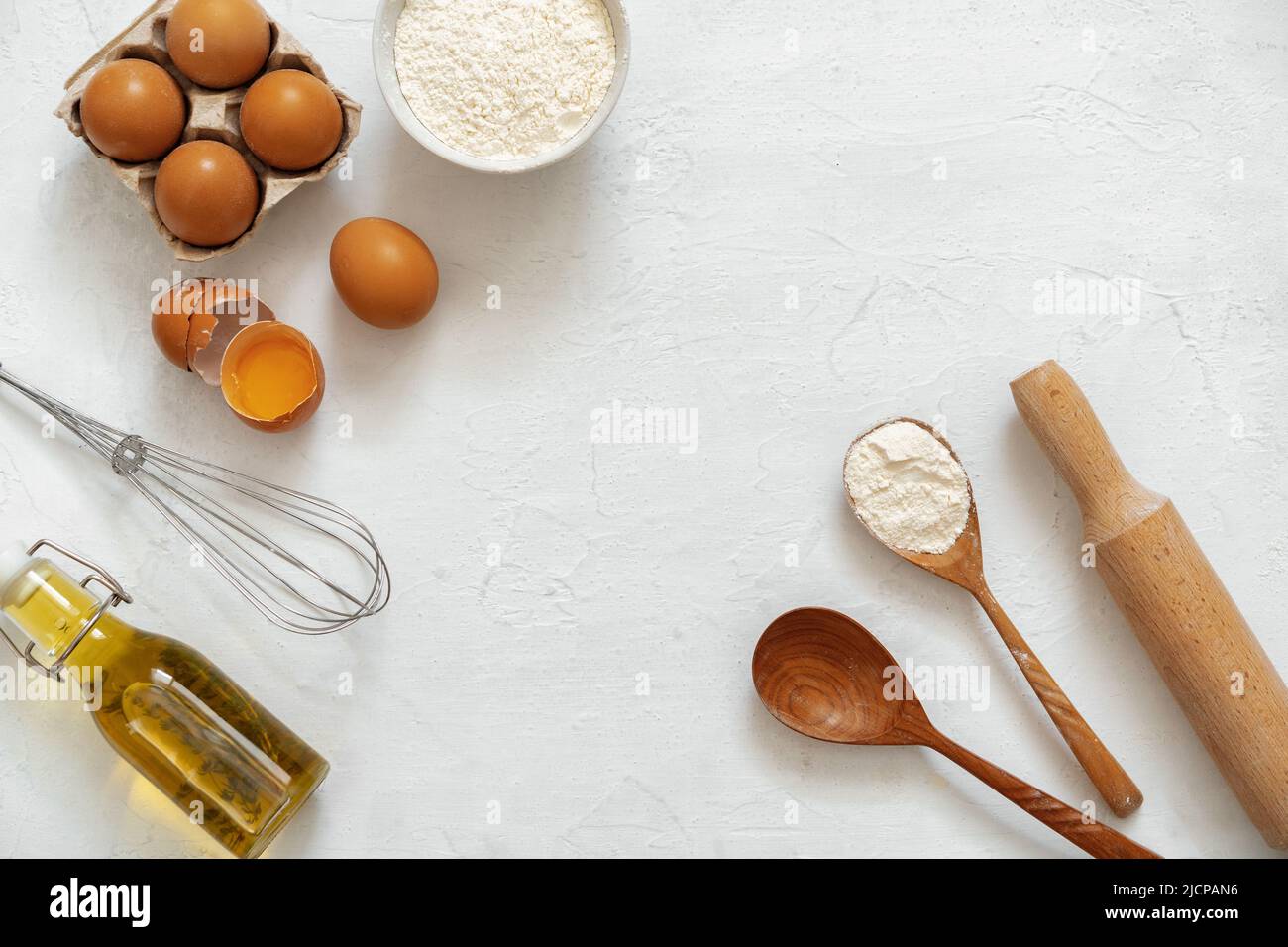 Preparation for baking. Eggs and flour on white background Stock Photo ...