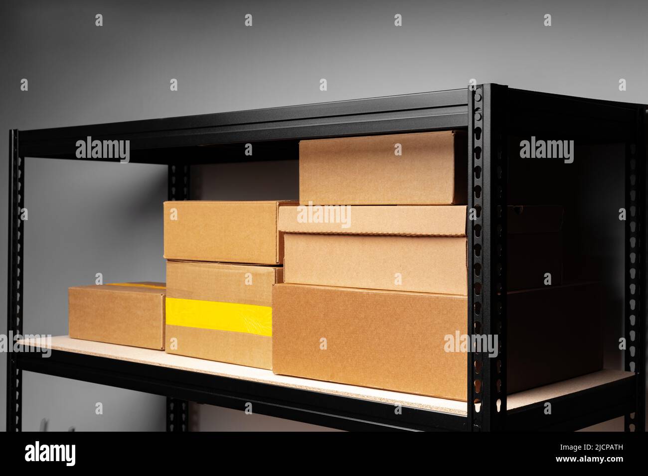 Rack shelves with paper boxes in warehouse Stock Photo - Alamy