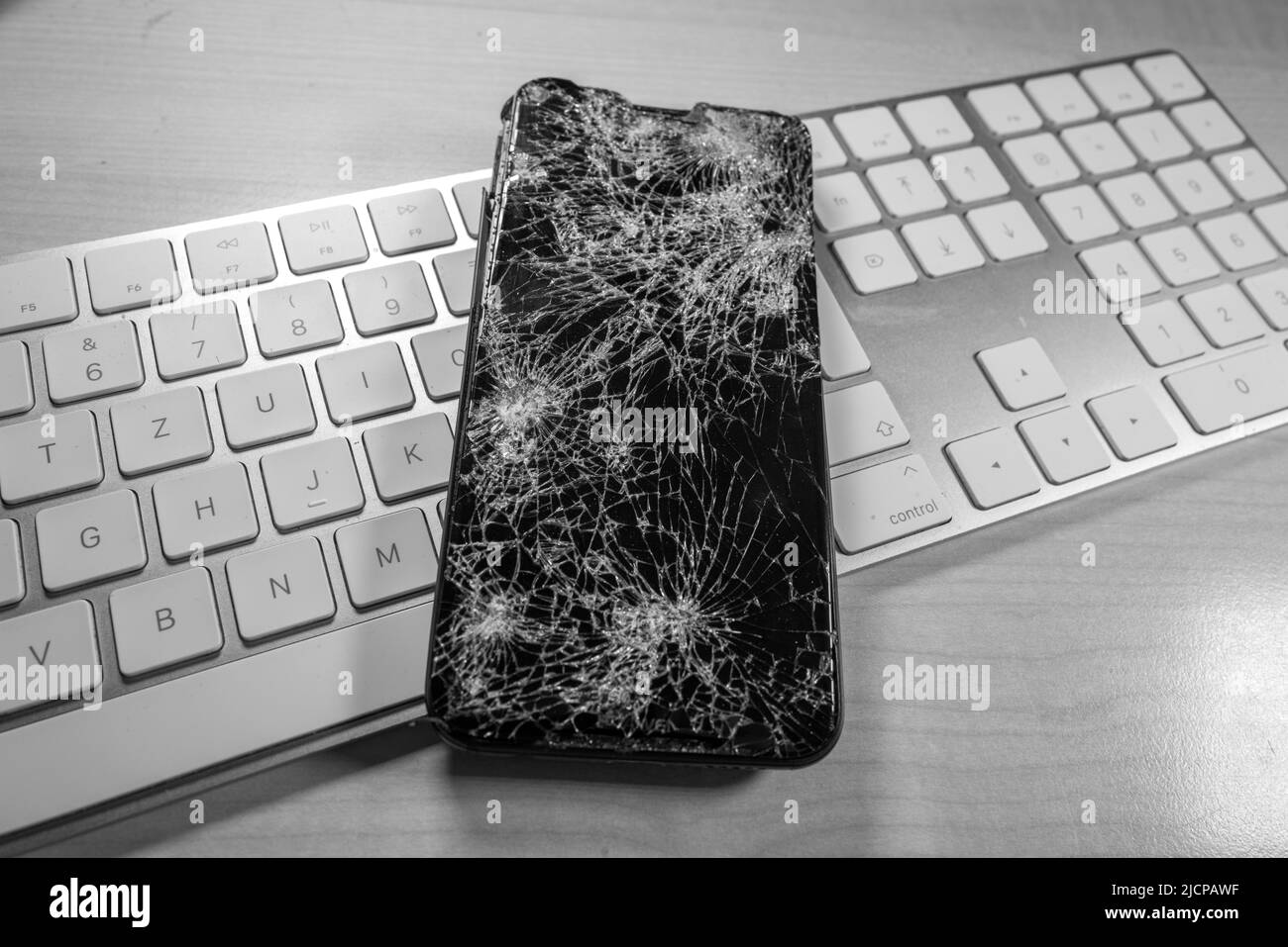 Smart phone with a cracked screen Black and White Stock Photos & Images ...