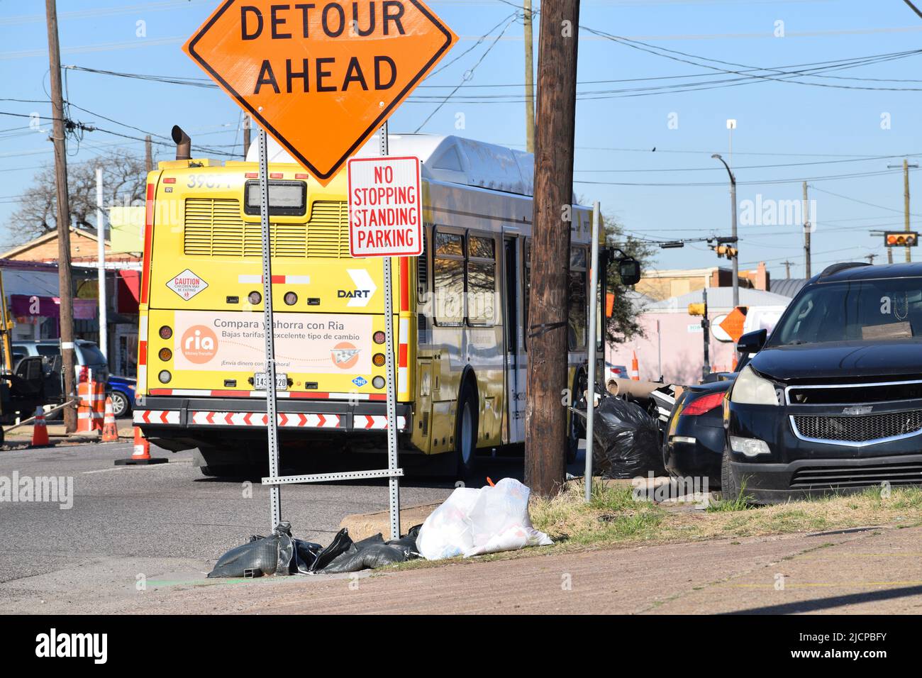 A DART (Dallas Area Rapid Transit) bus driving through a construction ...