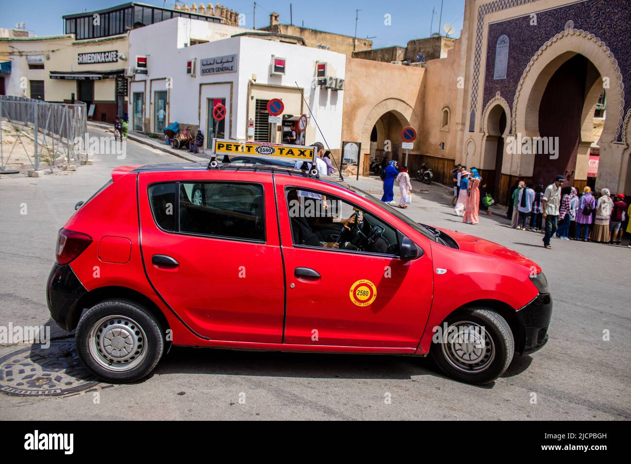 Fez, Morocco - June 14, 2022 Taxi driving through the streets of Fez ...
