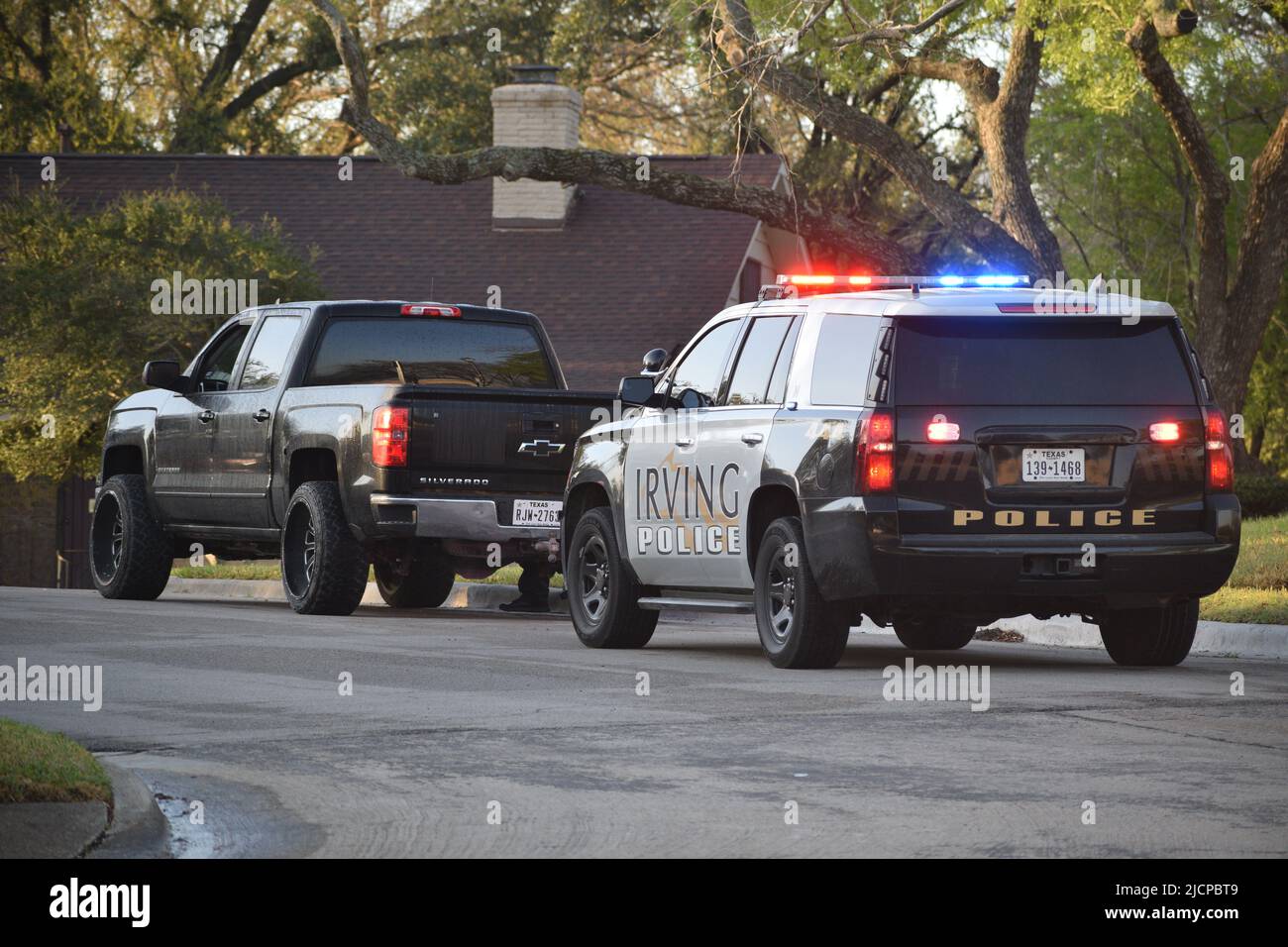 A police officer making an early morning traffic stop of a black ...