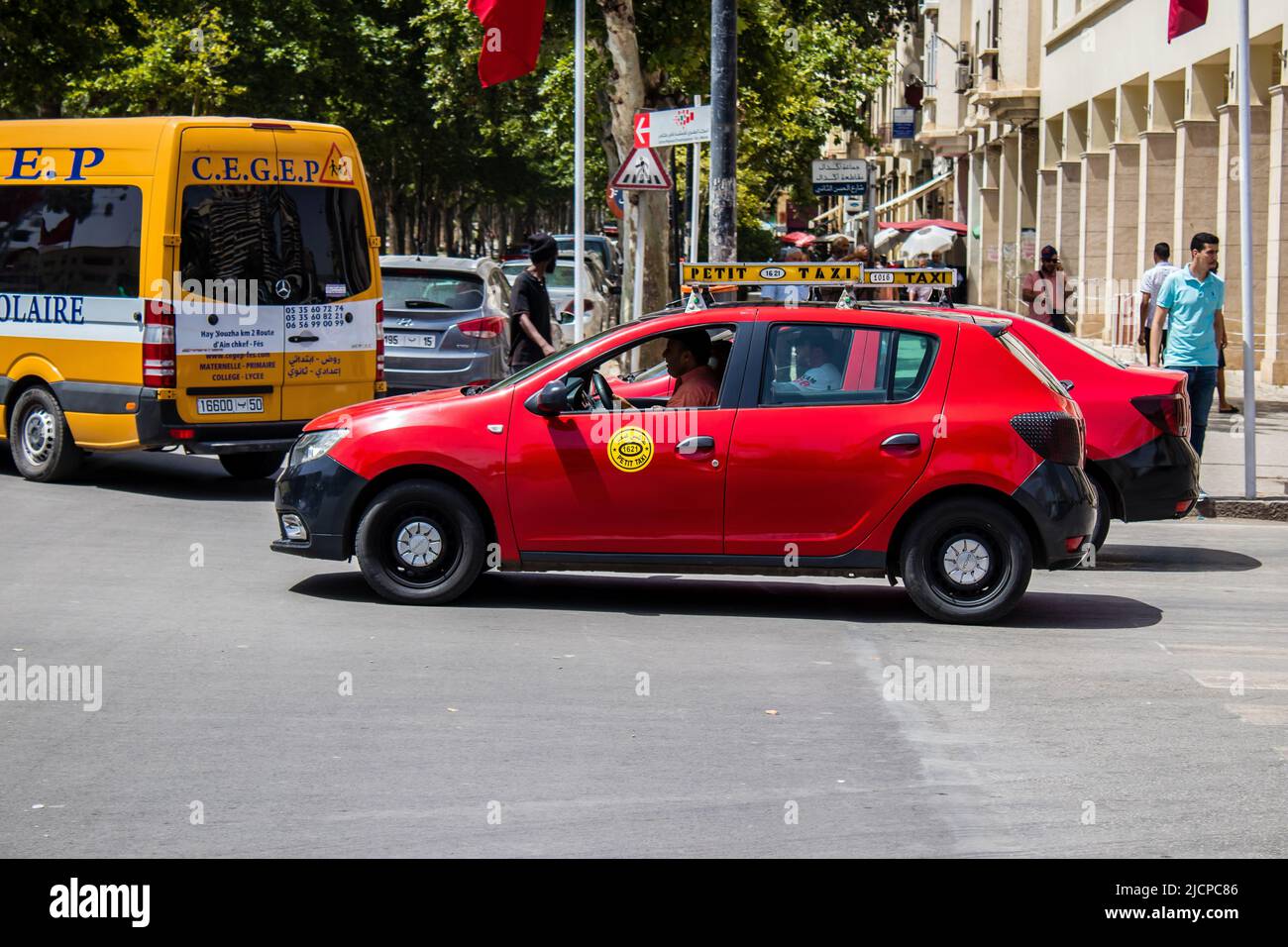 Fez, Morocco - June 14, 2022 Taxi driving through the streets of Fez ...